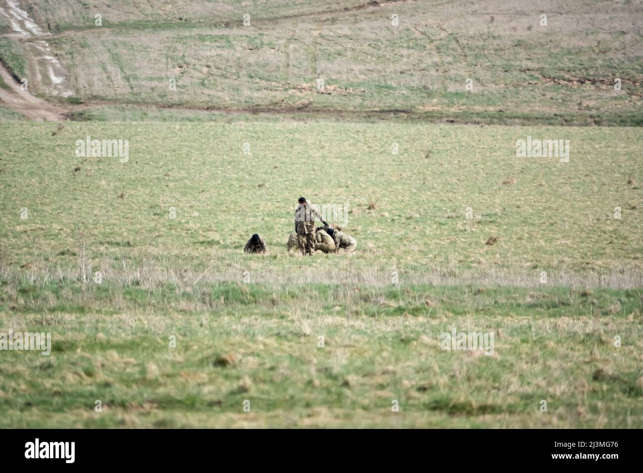 British army soldiers preparing in-ground explosives for a mock battle ...
