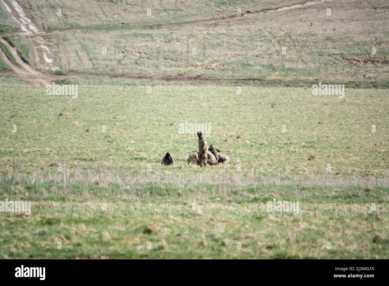 British army soldiers preparing in-ground explosives for a mock battle ...