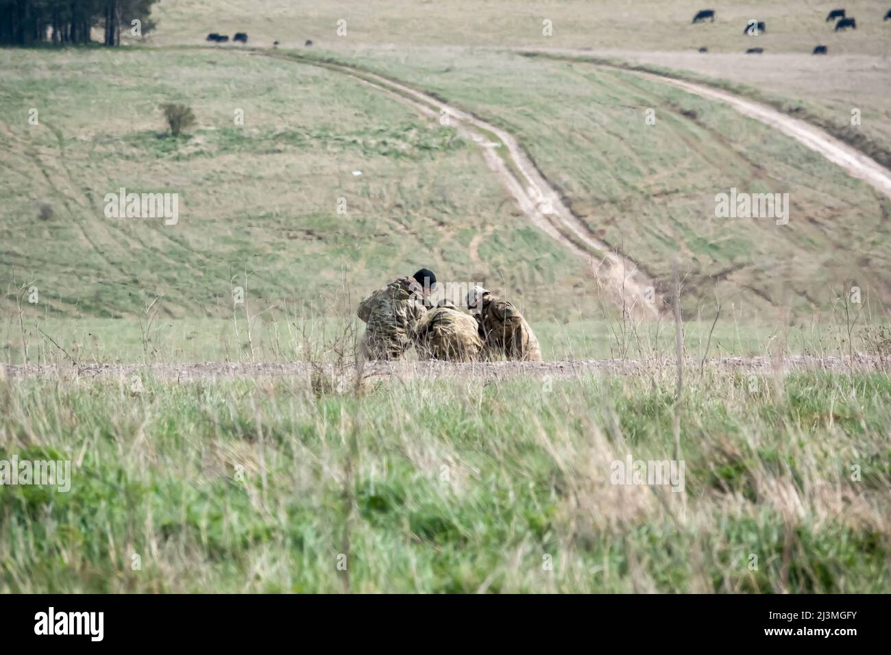 British army soldiers preparing in-ground explosives for a mock battle ...