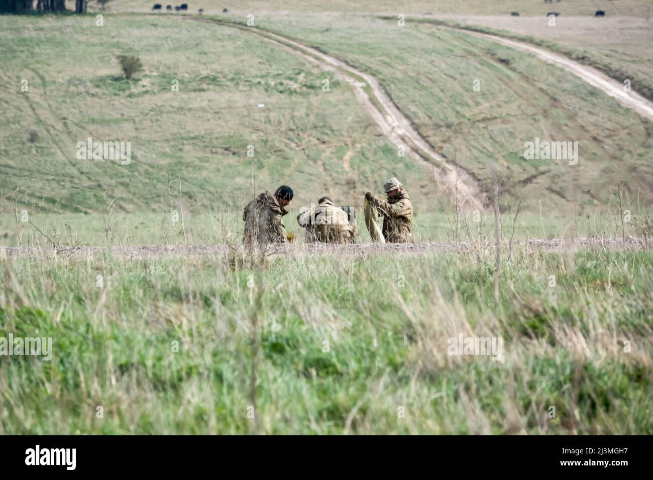 British army soldiers preparing in-ground explosives for a mock battle ...
