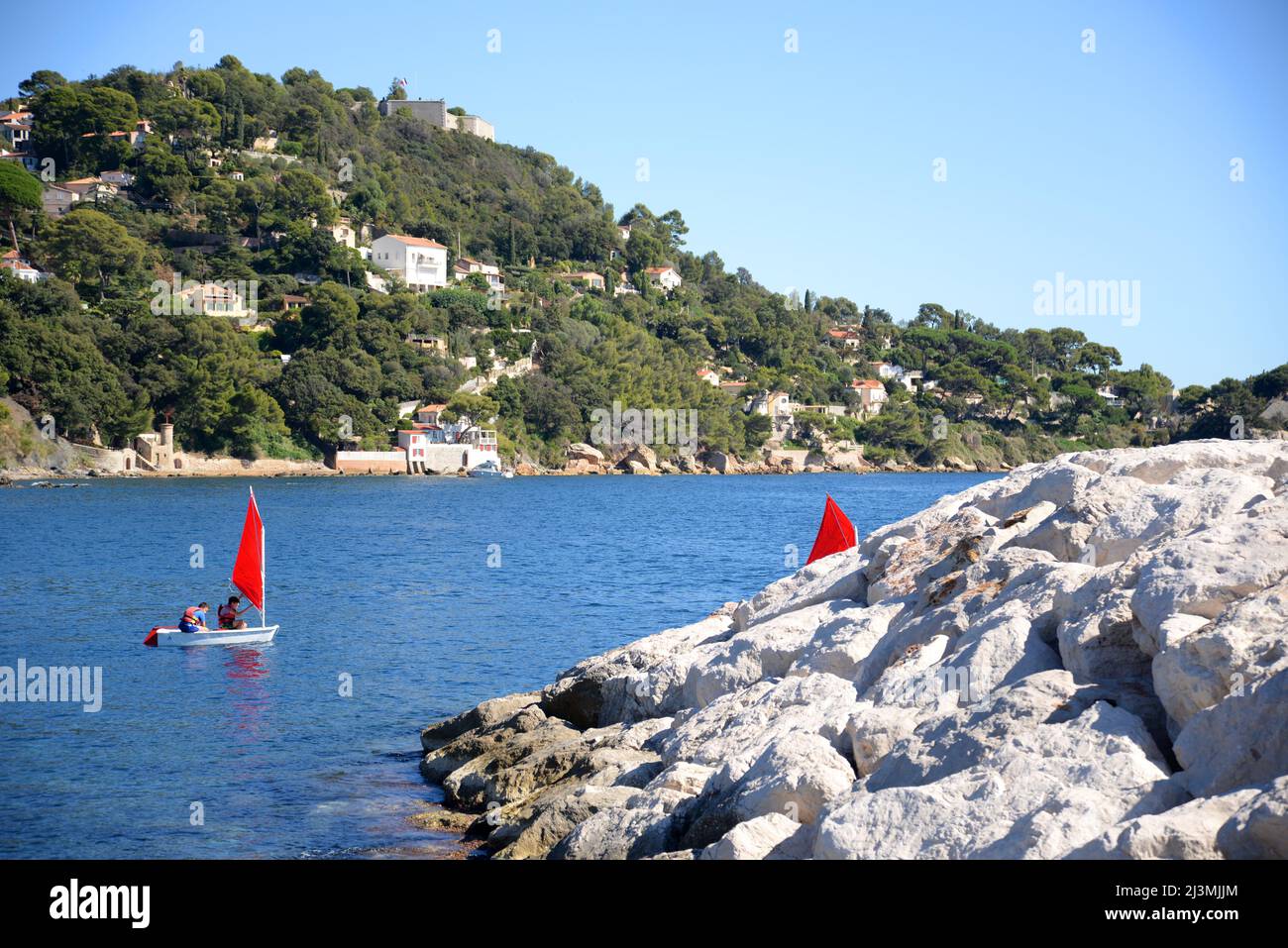 Red sails of the sailing school for childs in Toulon Stock Photo - Alamy