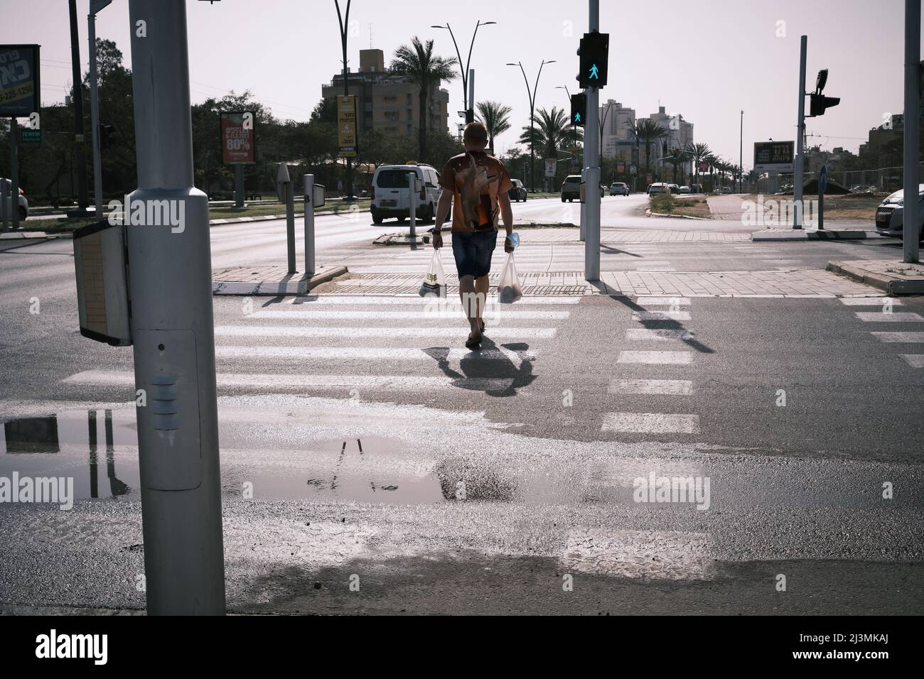 Man crossing the road hi-res stock photography and images - Alamy
