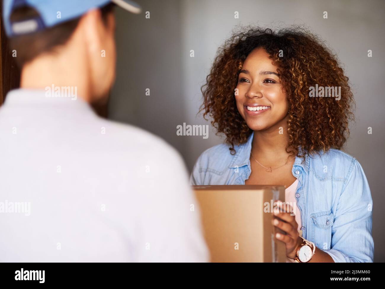 Talk about swift express delivery. Cropped shot of a woman receiving ...