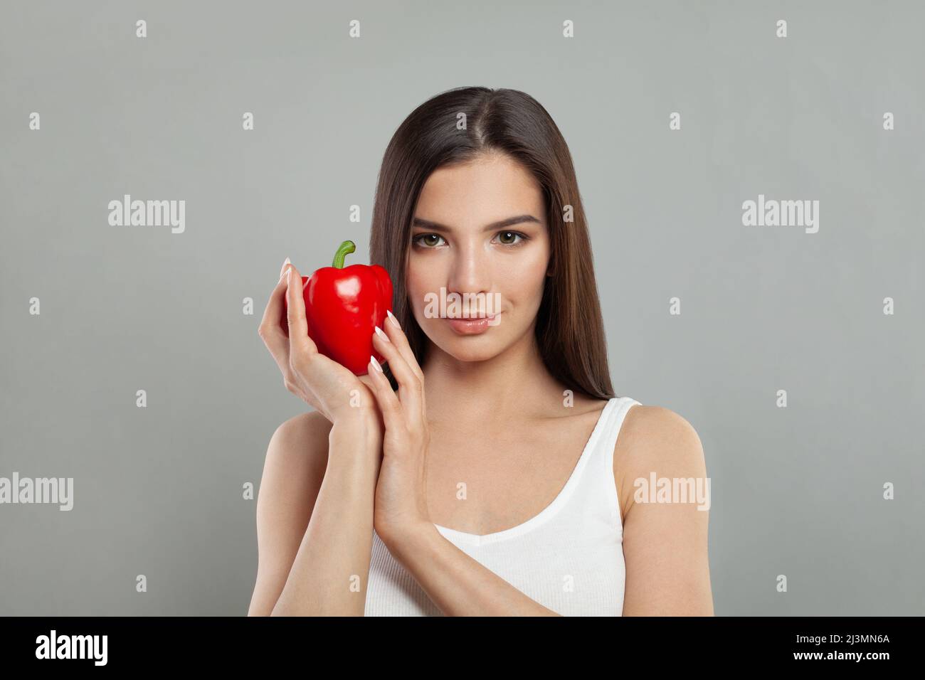 Healthy Eating. Beautiful Young Smiling Woman with Red Pepper. Healthy ...