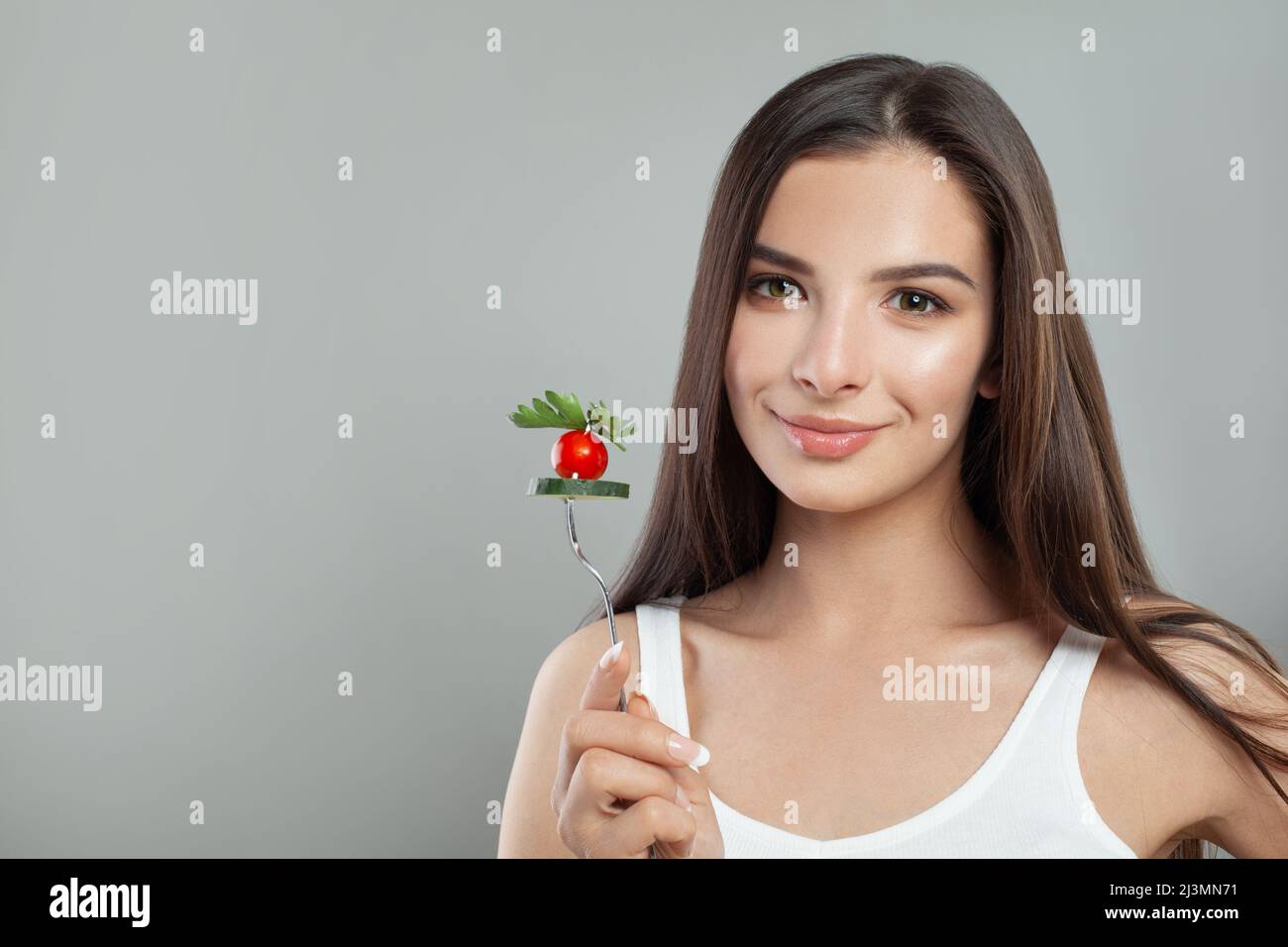 Cute young woman brunette with vegetable, healthy eating portrait Stock ...