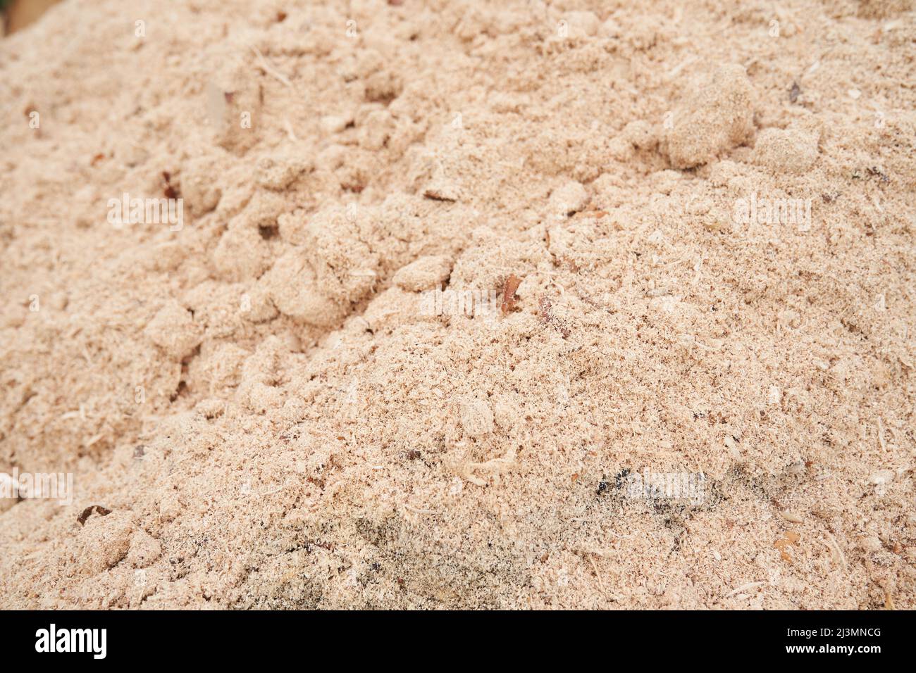 Sawdust stacked in a slide. The background is made of natural sawdust ...