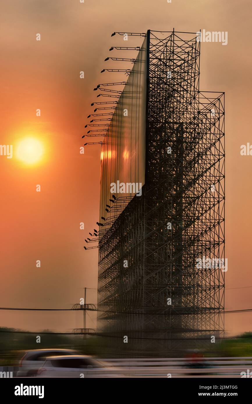 The screen is like a mega-structure against the backdrop of a freeway ...