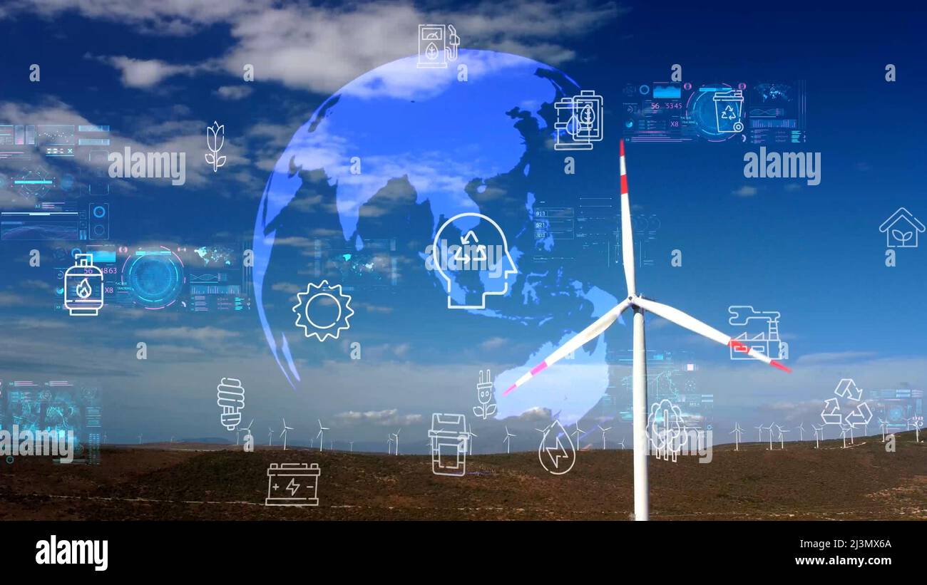 Aerial view over the farm landscape and wind turbines generating clean ...