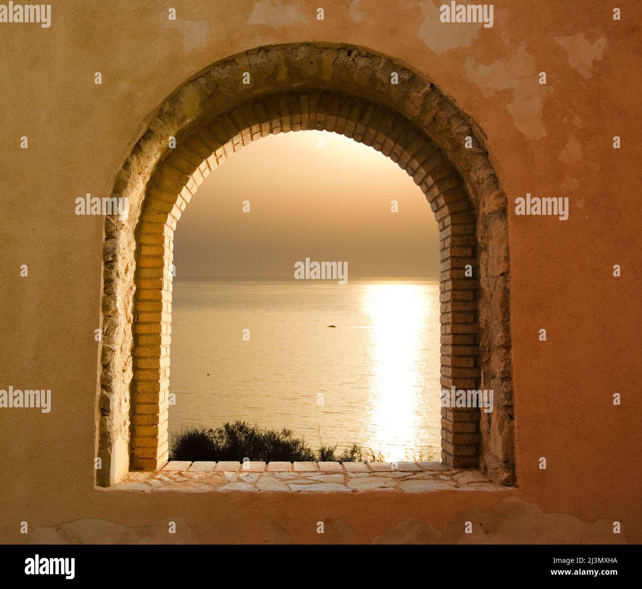 sunset on the sea through the windows Stock Photo - Alamy