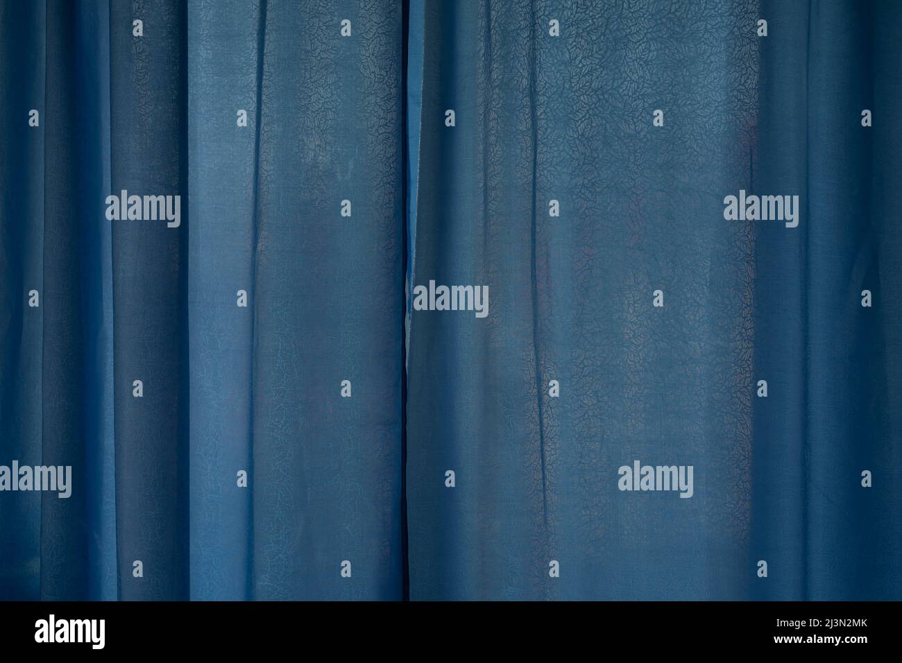 Brightly blue curtain texture background Stock Photo - Alamy