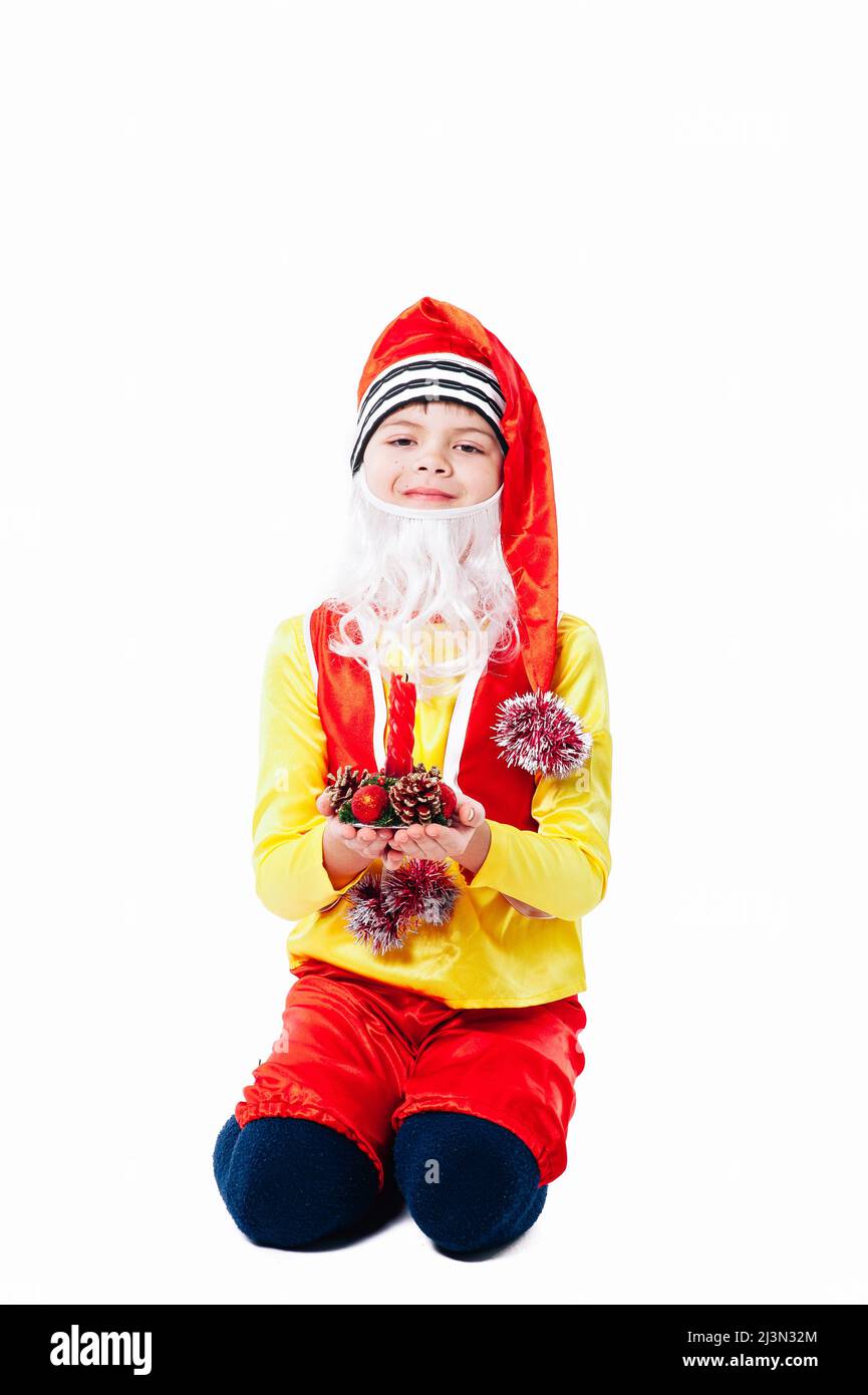 A baby dressed as a elf. isolated. Santa's helper. boy in suit of dwarf ...