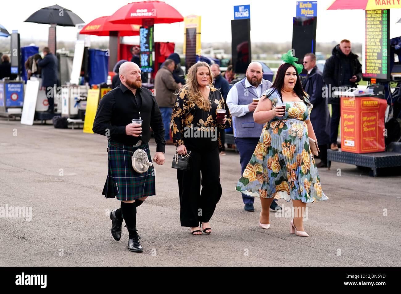 Race goers arrive prior to racing on Grand National Day of the Randox ...