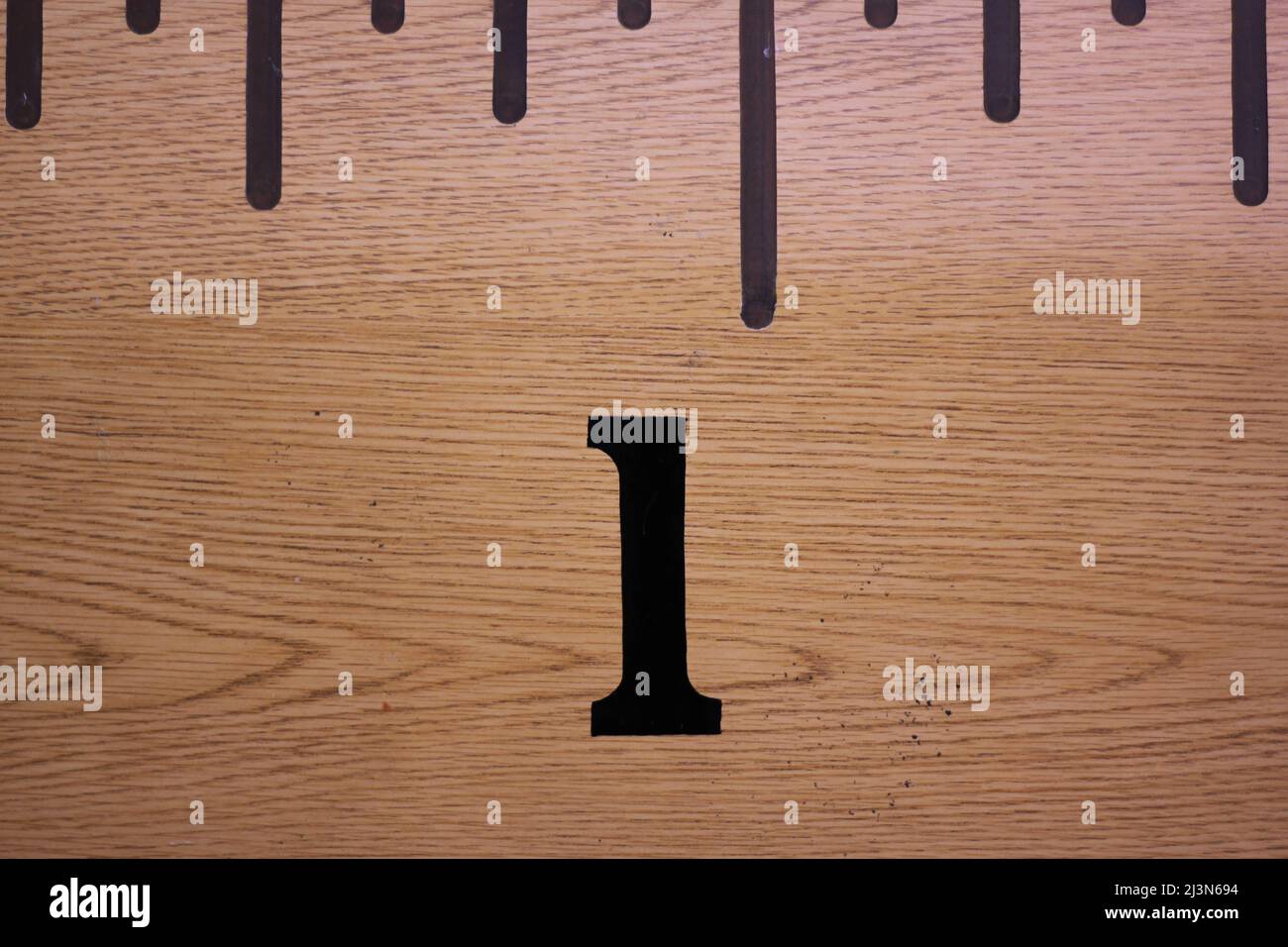 Closeup of the number one on a traditional wooden school ruler used to ...