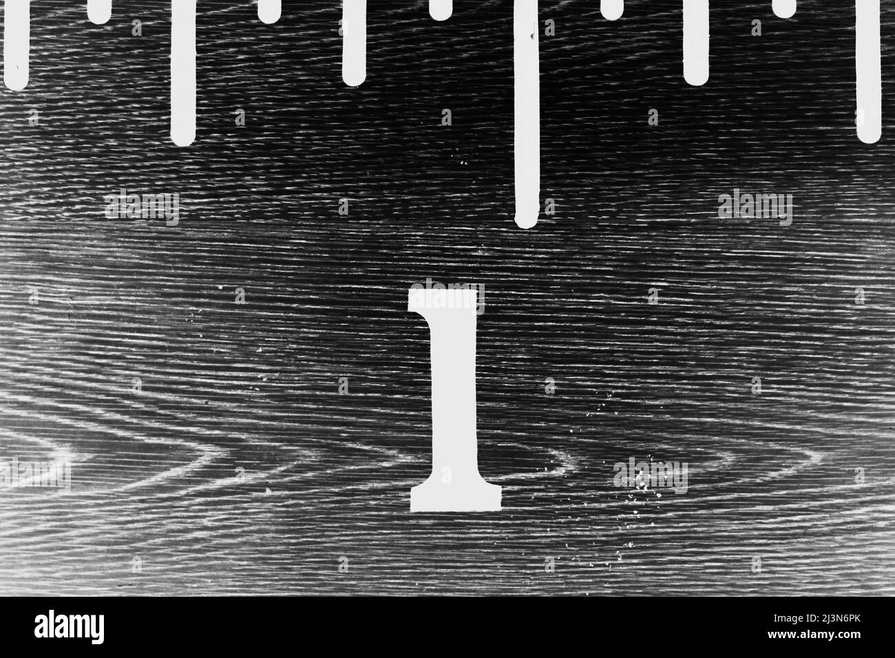 Closeup of the number one on a traditional wooden school ruler used to ...