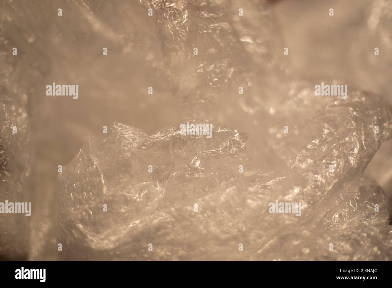 White crumpled film made of plastic. Plastic bag texture. Background is ...