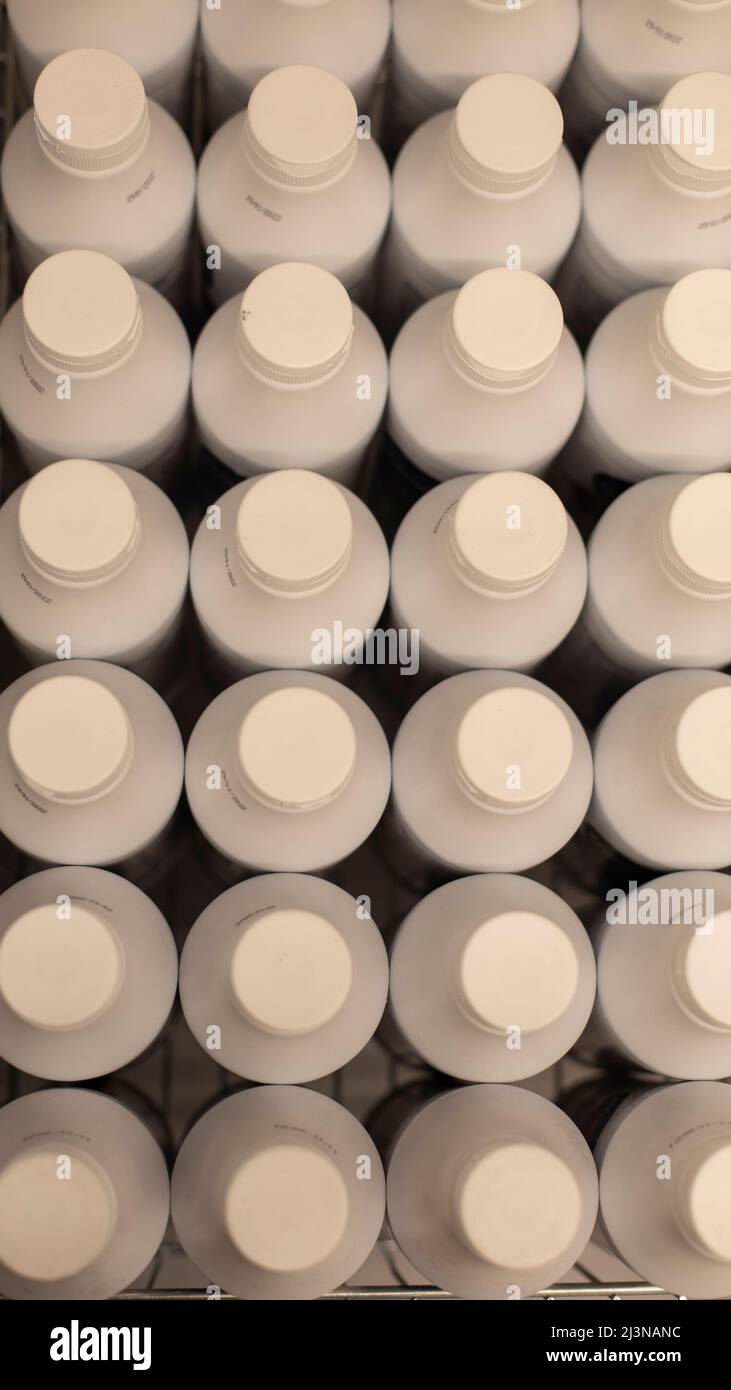 White plastic bottles top view. Lots of milk bottles. Texture from ...
