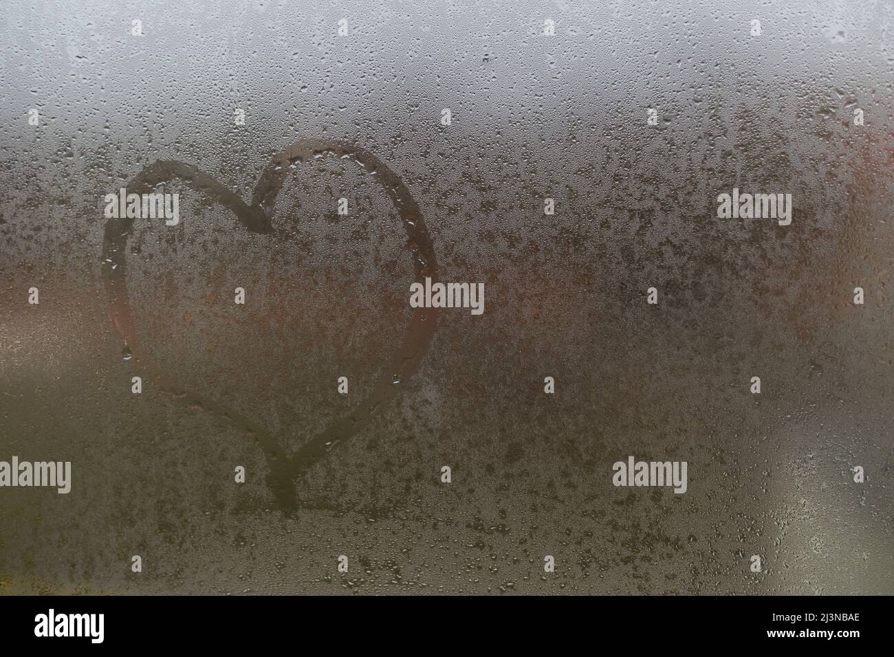 Woman drawing heart shape on glass hi-res stock photography and images ...