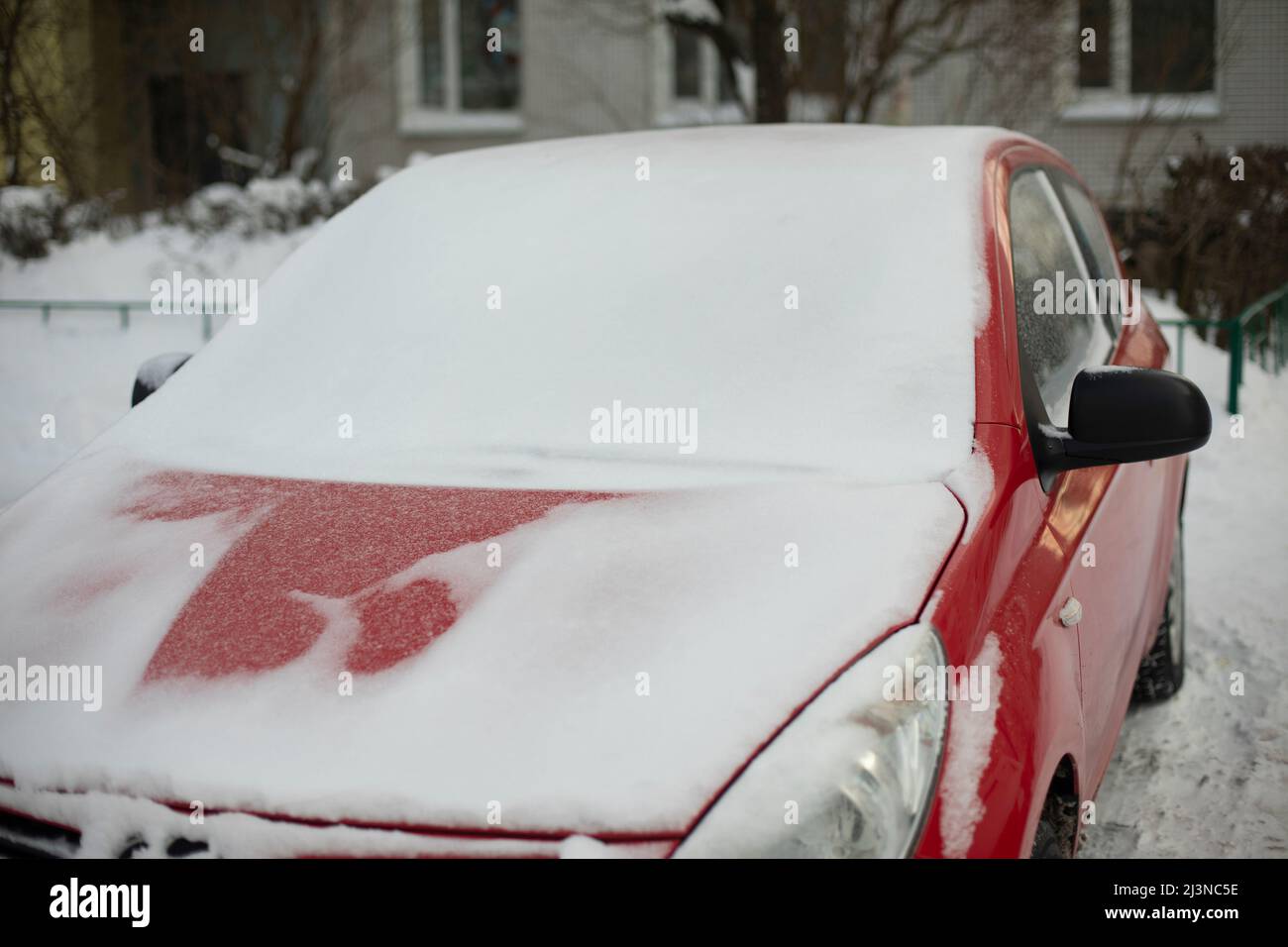 Car is in snow in parking lot. Icy car. Transport in winter. Parking ...