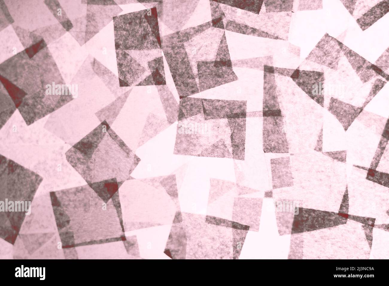 Craft tissue paper glued to a window as an abstract pink translucent ...