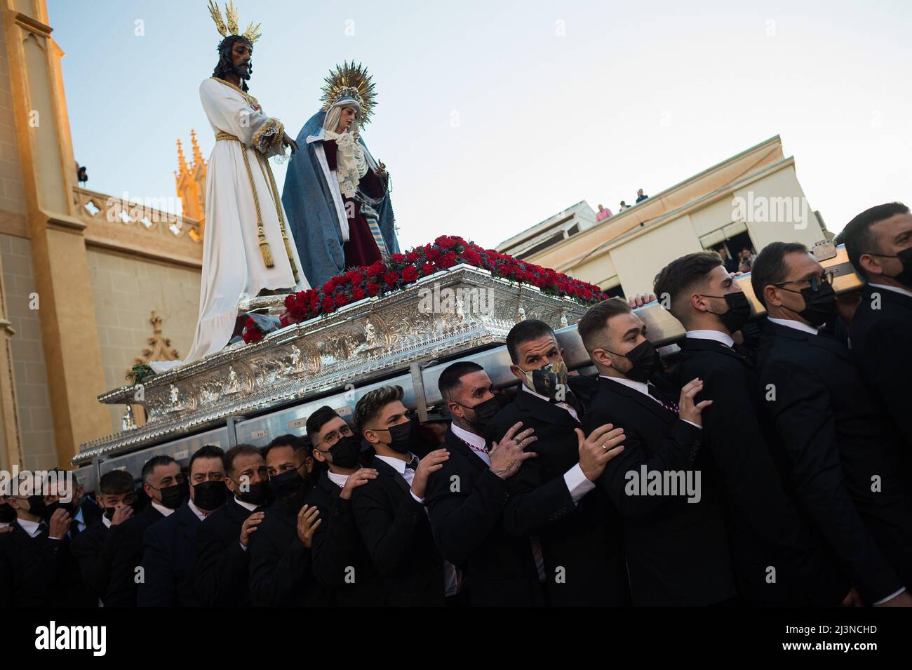 Men of "Cautivo" brotherhood are seen carrying the statue of Christ and ...