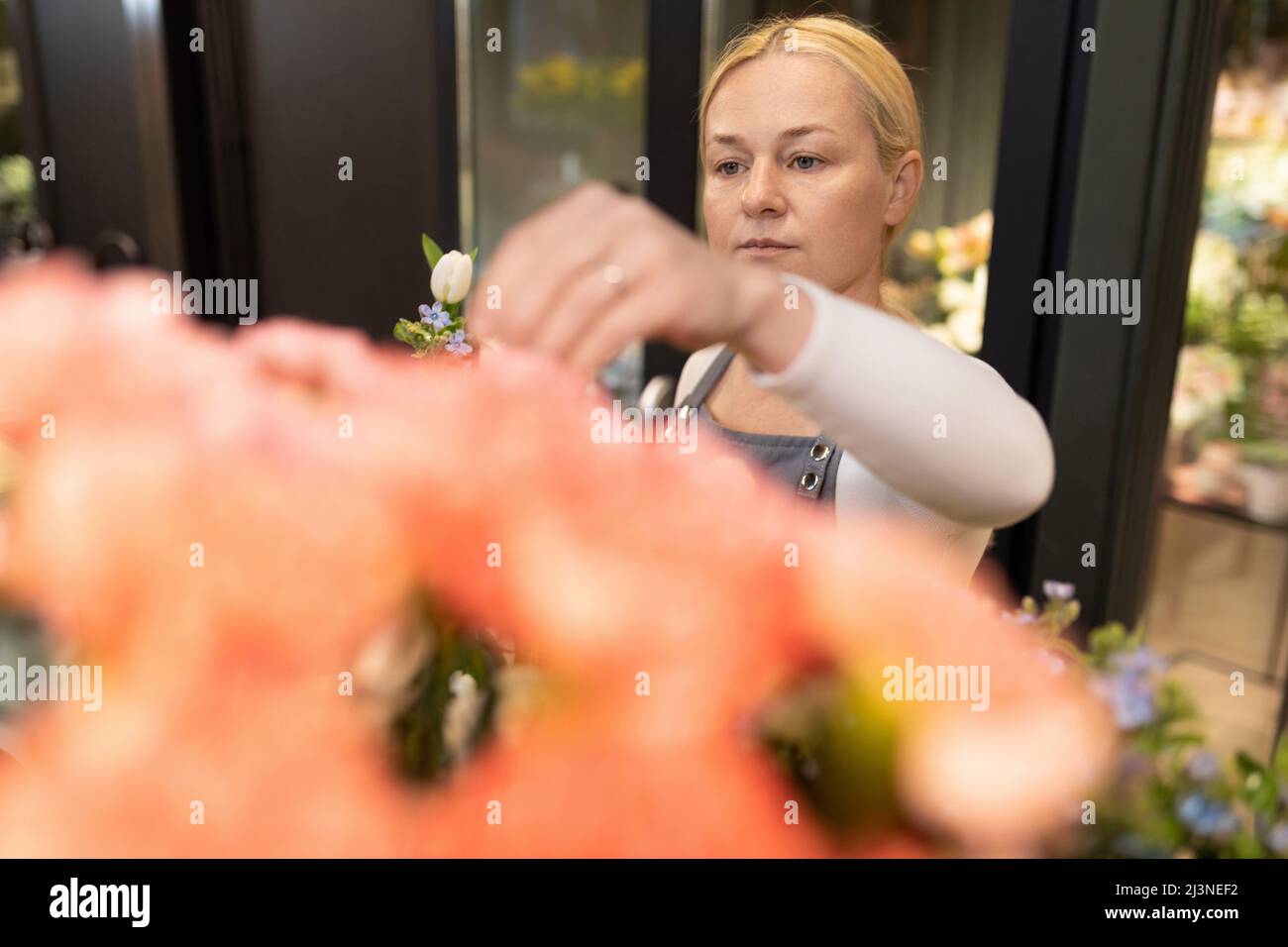 flower shop worker picking a bouquet of fresh flowers Stock Photo - Alamy