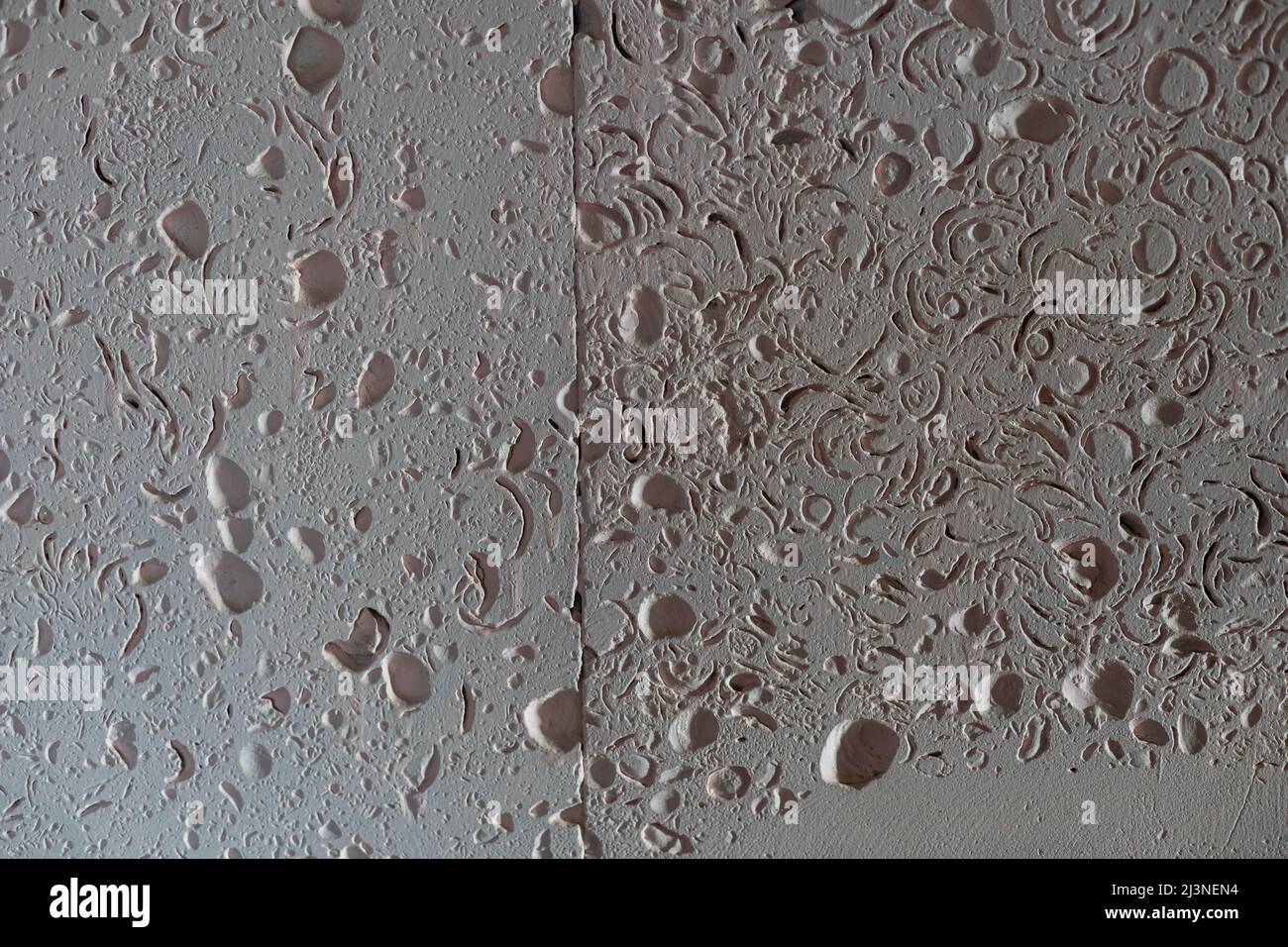 Textured wall lined with shell rock tiles Stock Photo - Alamy