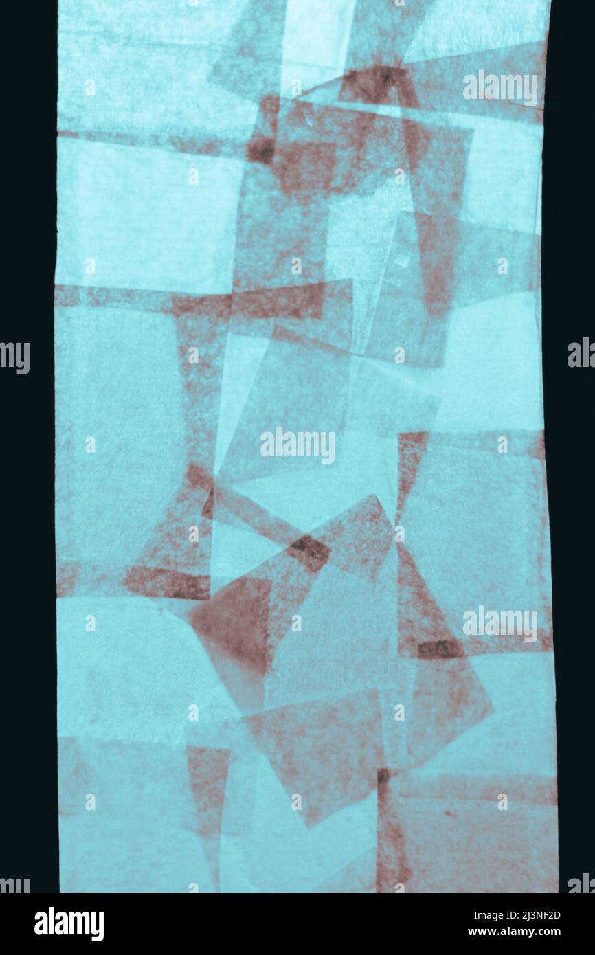 Craft tissue paper glued to a window as an abstract blue translucent ...