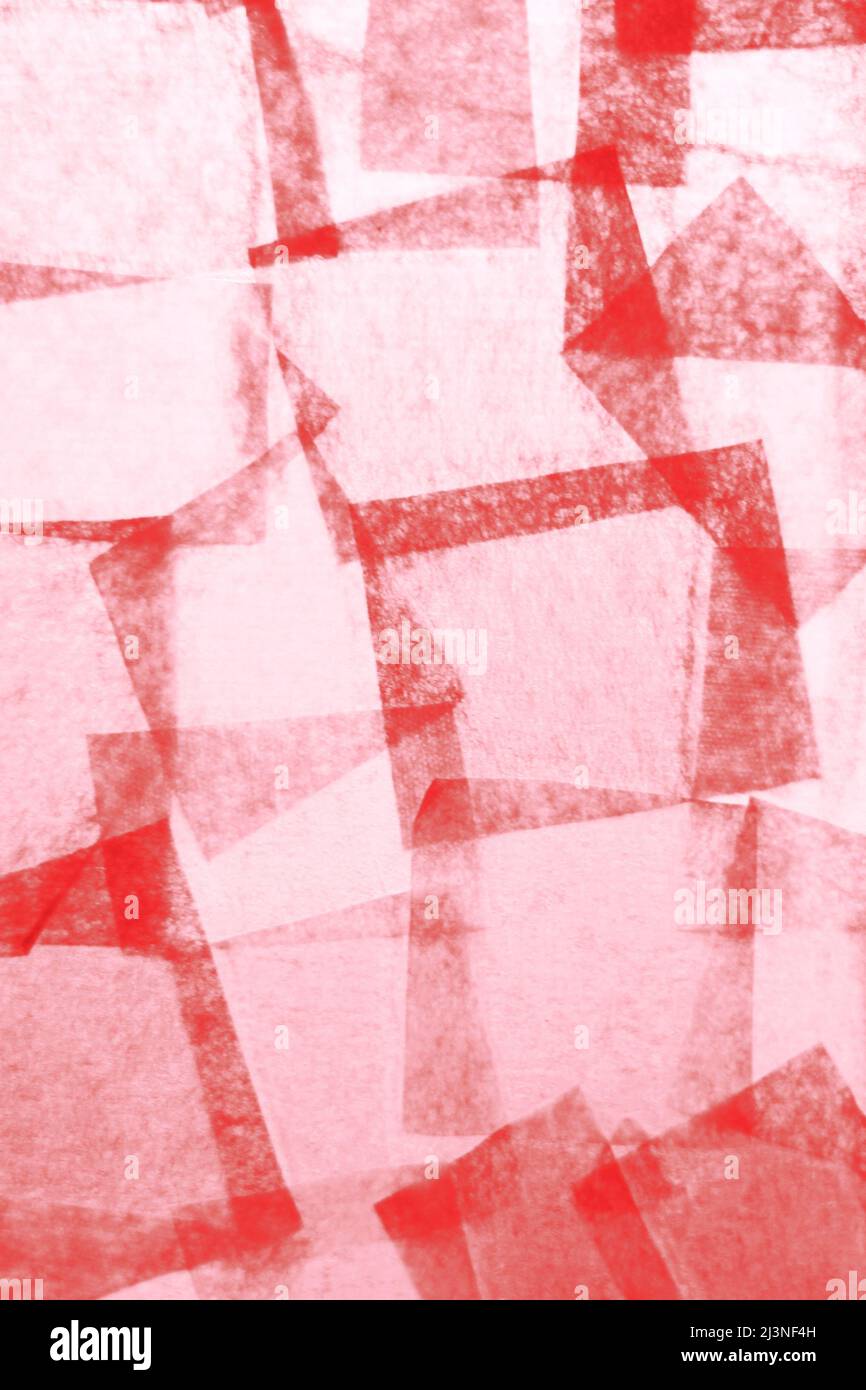 Craft tissue paper glued to a window as an abstract pink translucent ...