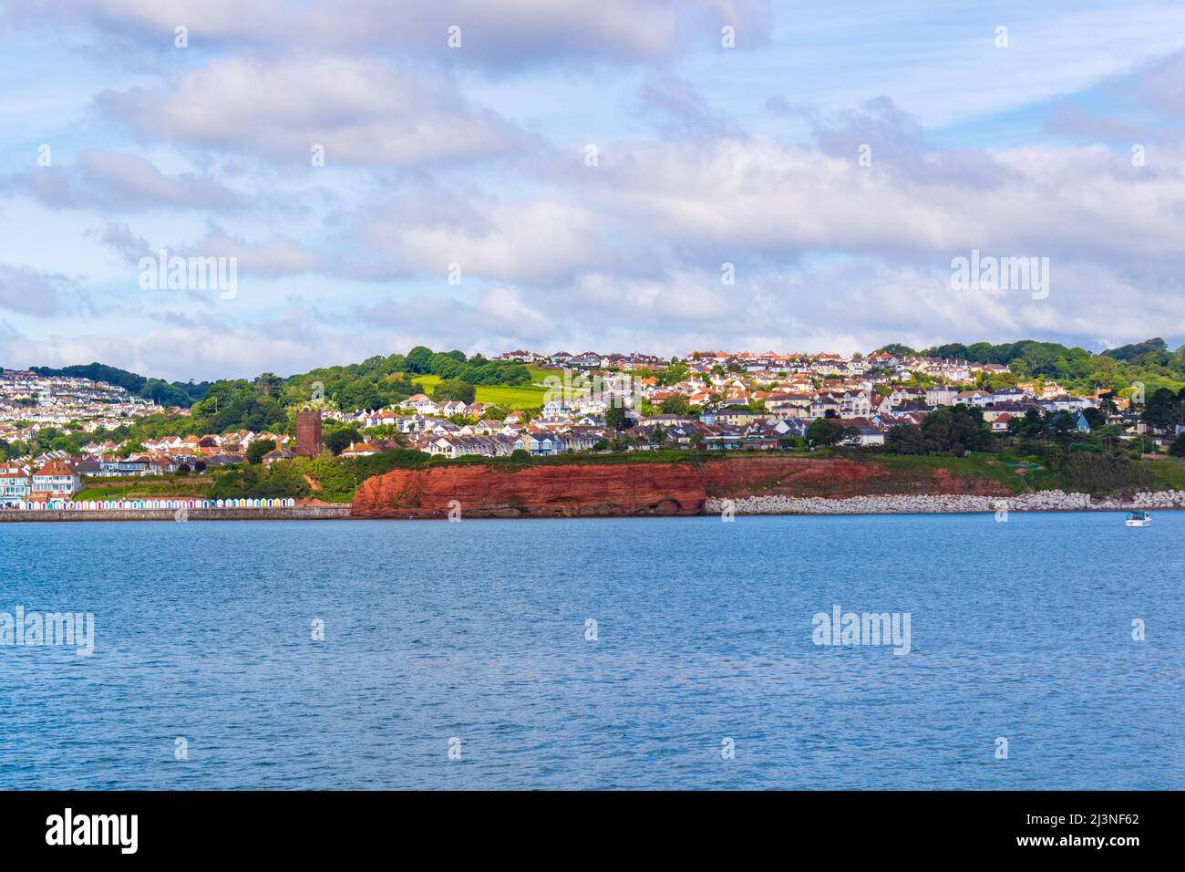 View of Paignton town seaside and beach with a long pier juts out from ...