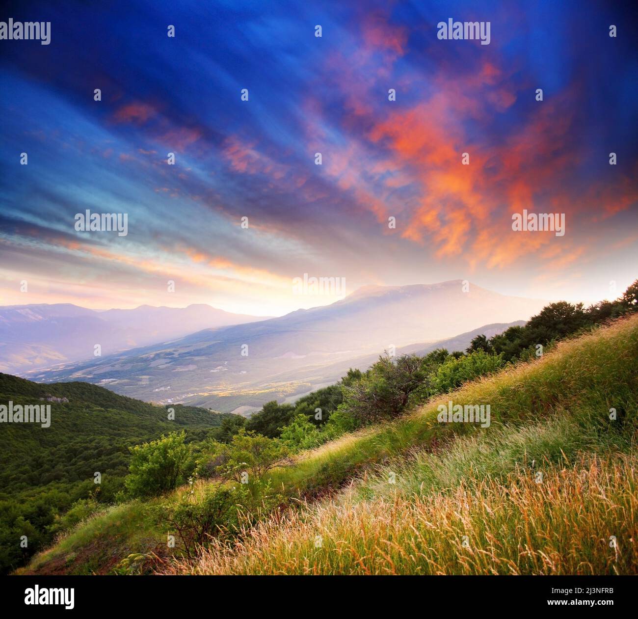 Landscape with mountains under morning sky with clouds Stock Photo - Alamy