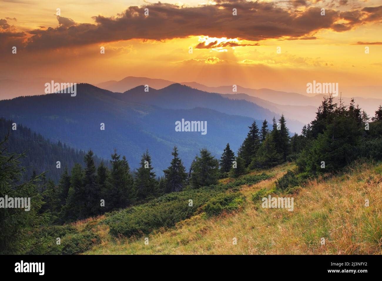 Landscape with mountains under morning sky with clouds Stock Photo - Alamy