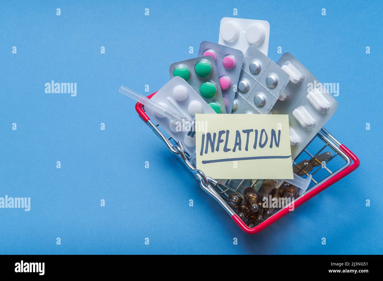 A basket with medical preparations in it on a blue background with ...