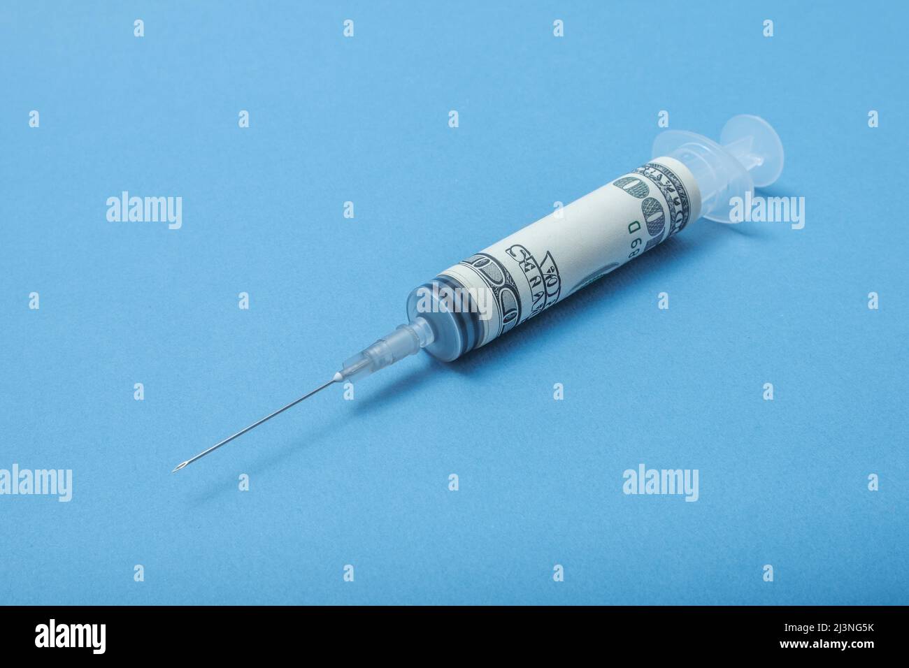 A syringe wrapped in a dollar. Financial injection into the economy ...