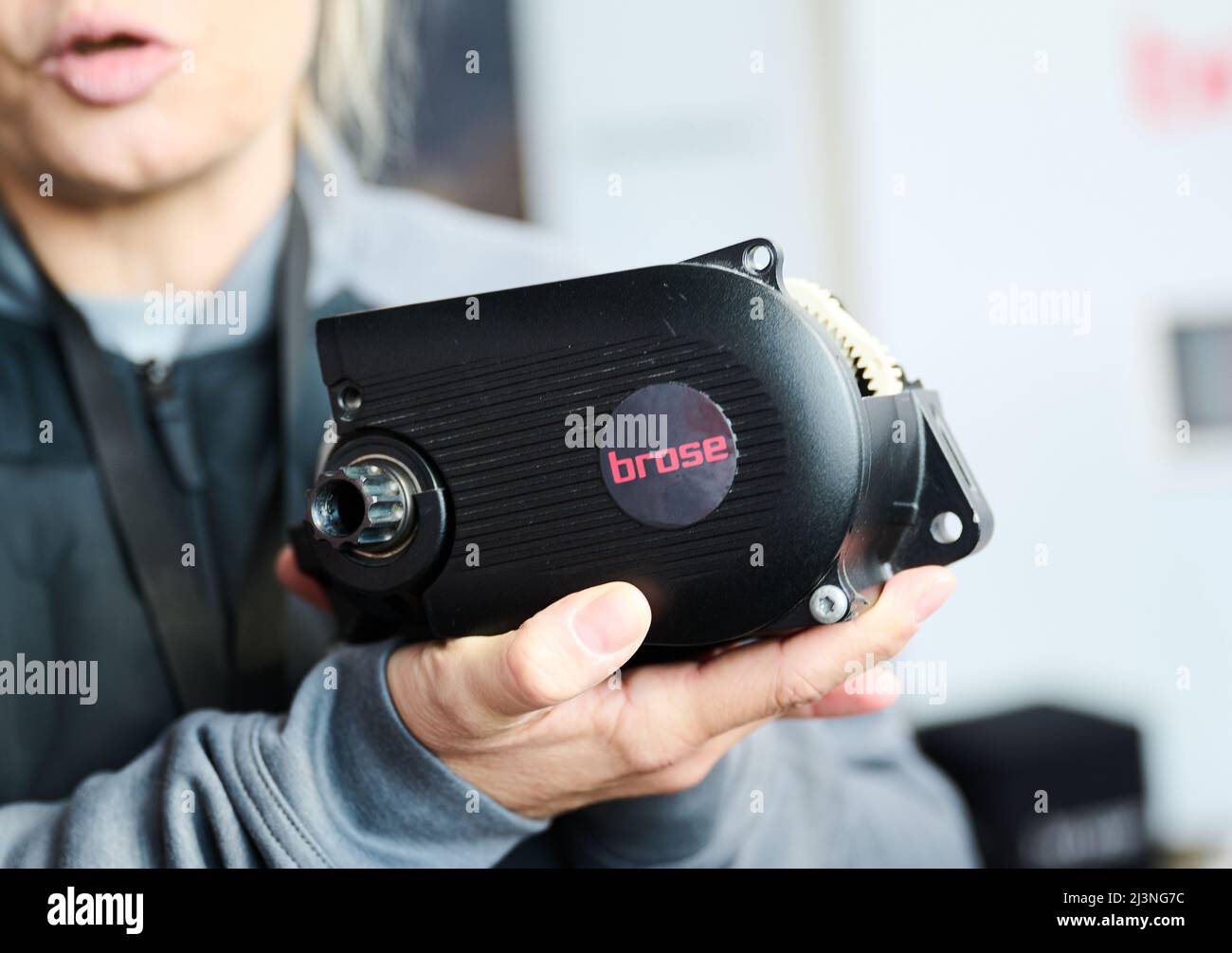 Berlin, Germany. 09th Apr, 2022. An employee of the Brose company holds ...
