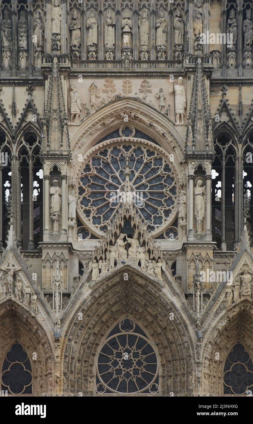 Gothic rose window on the west facade of the Reims Cathedral ...