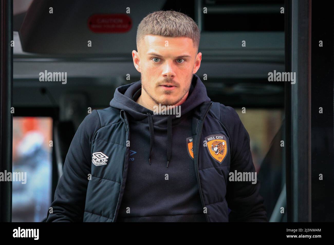 Regan Slater #27 of Hull City gets off the team bus on arrival at The ...