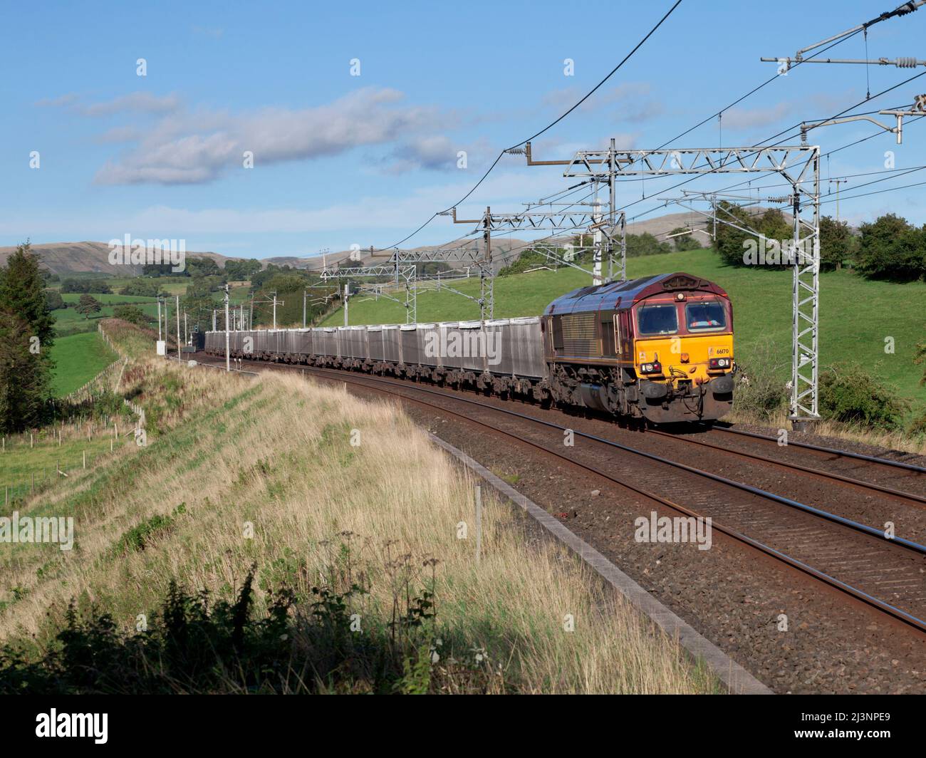 DB Cargo class 66 locomotive in EWS livery passing Lambrigg (north of ...
