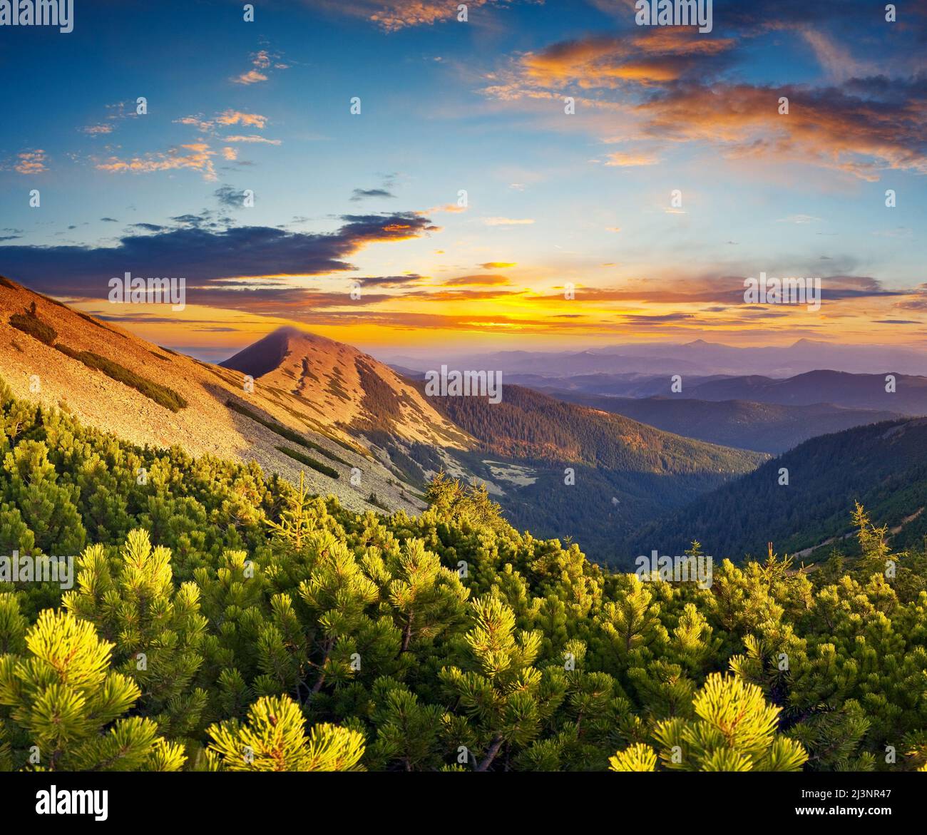 Landscape with mountains under morning sky with clouds Stock Photo - Alamy