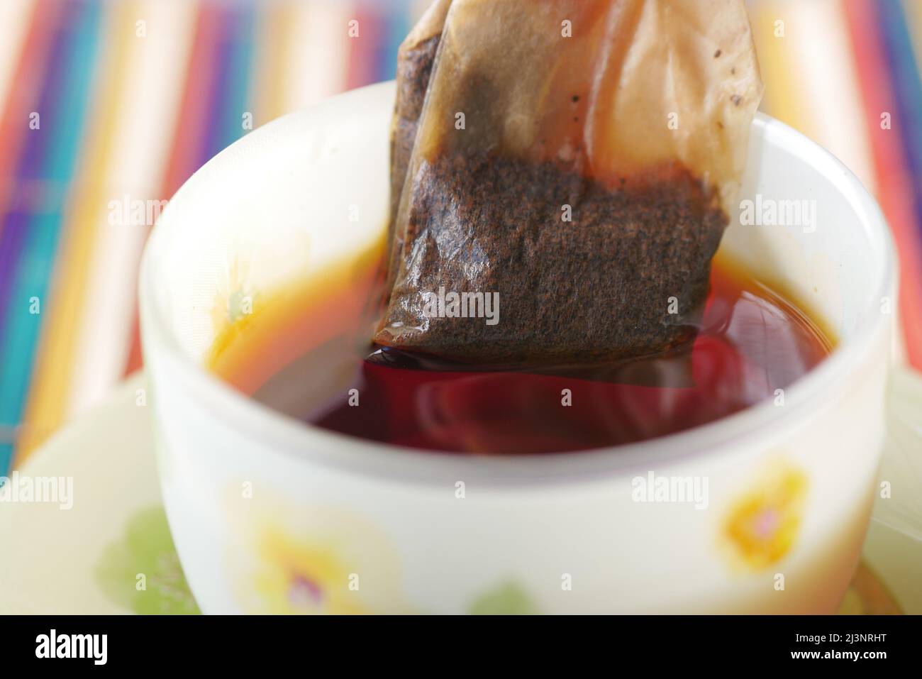 green tea and tea bag on table, close up Stock Photo - Alamy