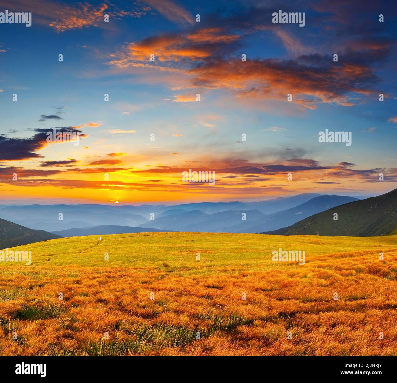 Landscape with mountains under morning sky with clouds Stock Photo - Alamy