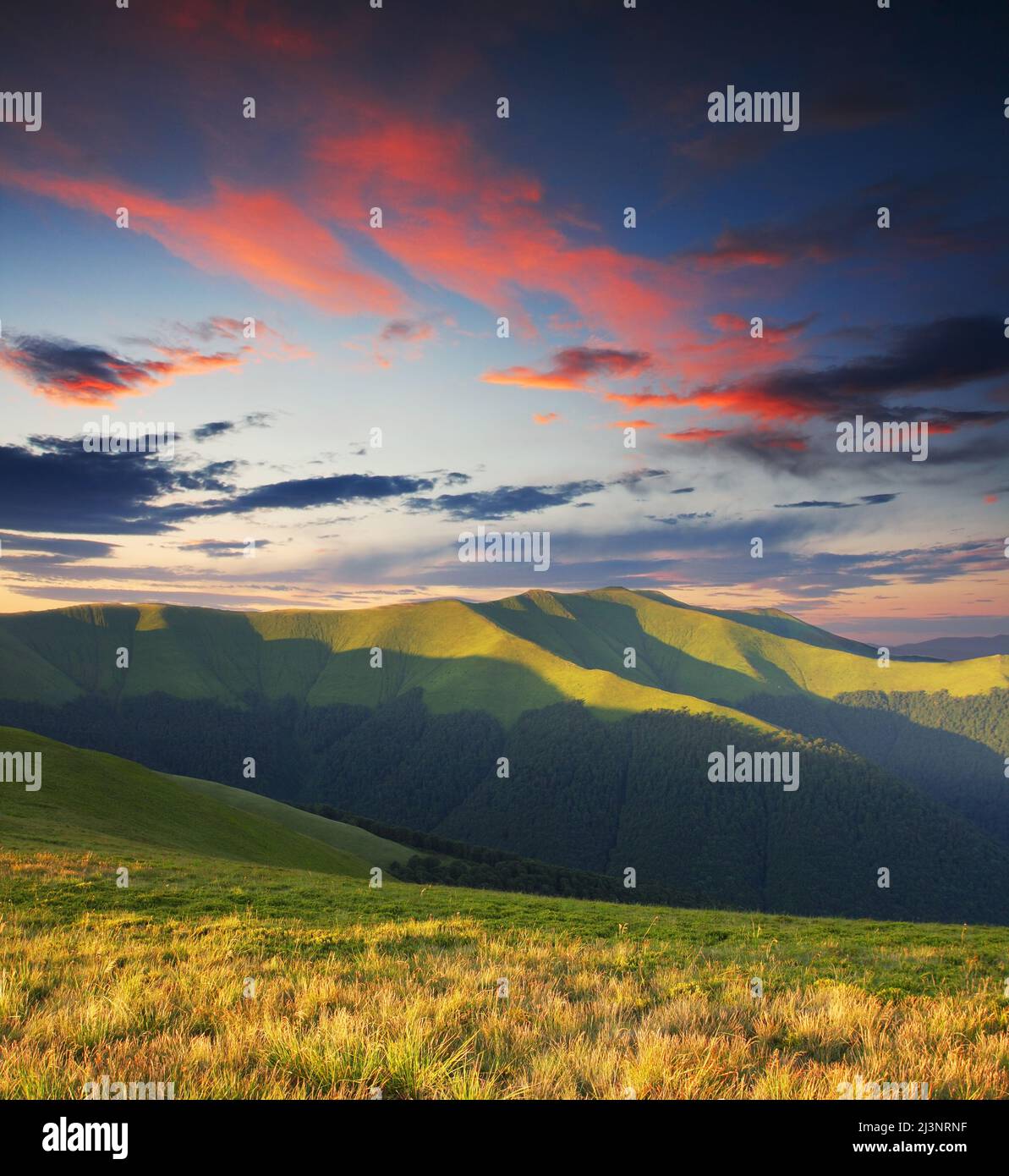 Landscape with mountains under morning sky with clouds Stock Photo - Alamy
