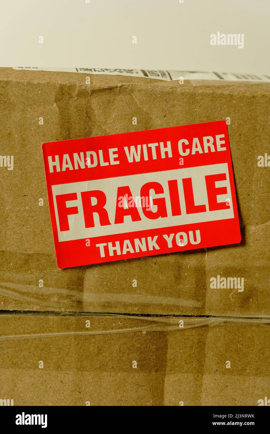 A close up of a package with a fragile, handle with care sticker label ...