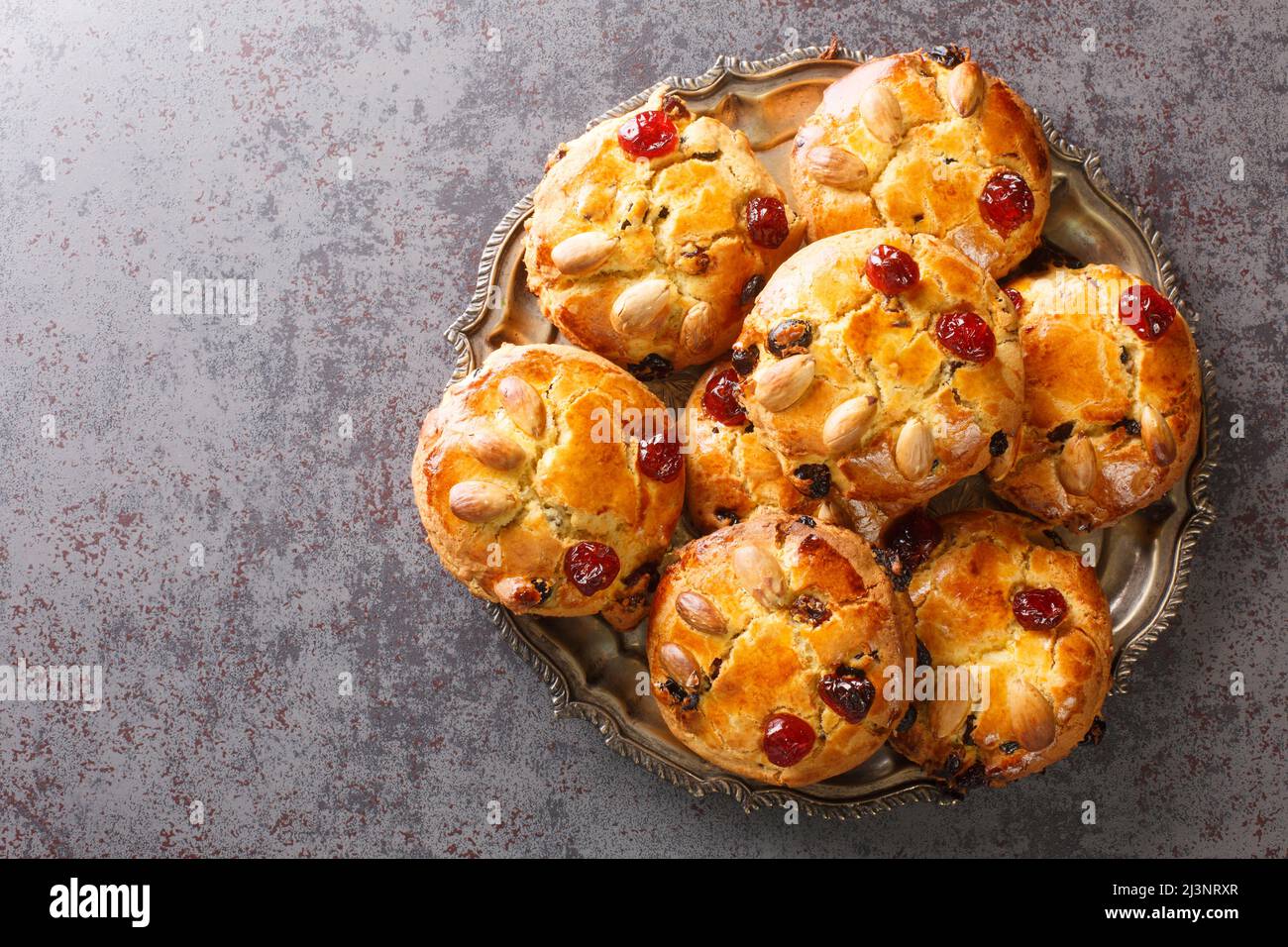 English Fat Rascals scones with dried fruits and almonds close-up in a ...