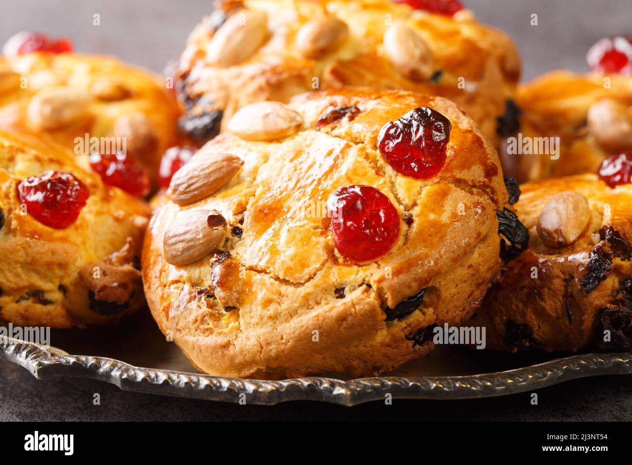 English Fat Rascals scones with dried fruits and almonds close-up in a ...