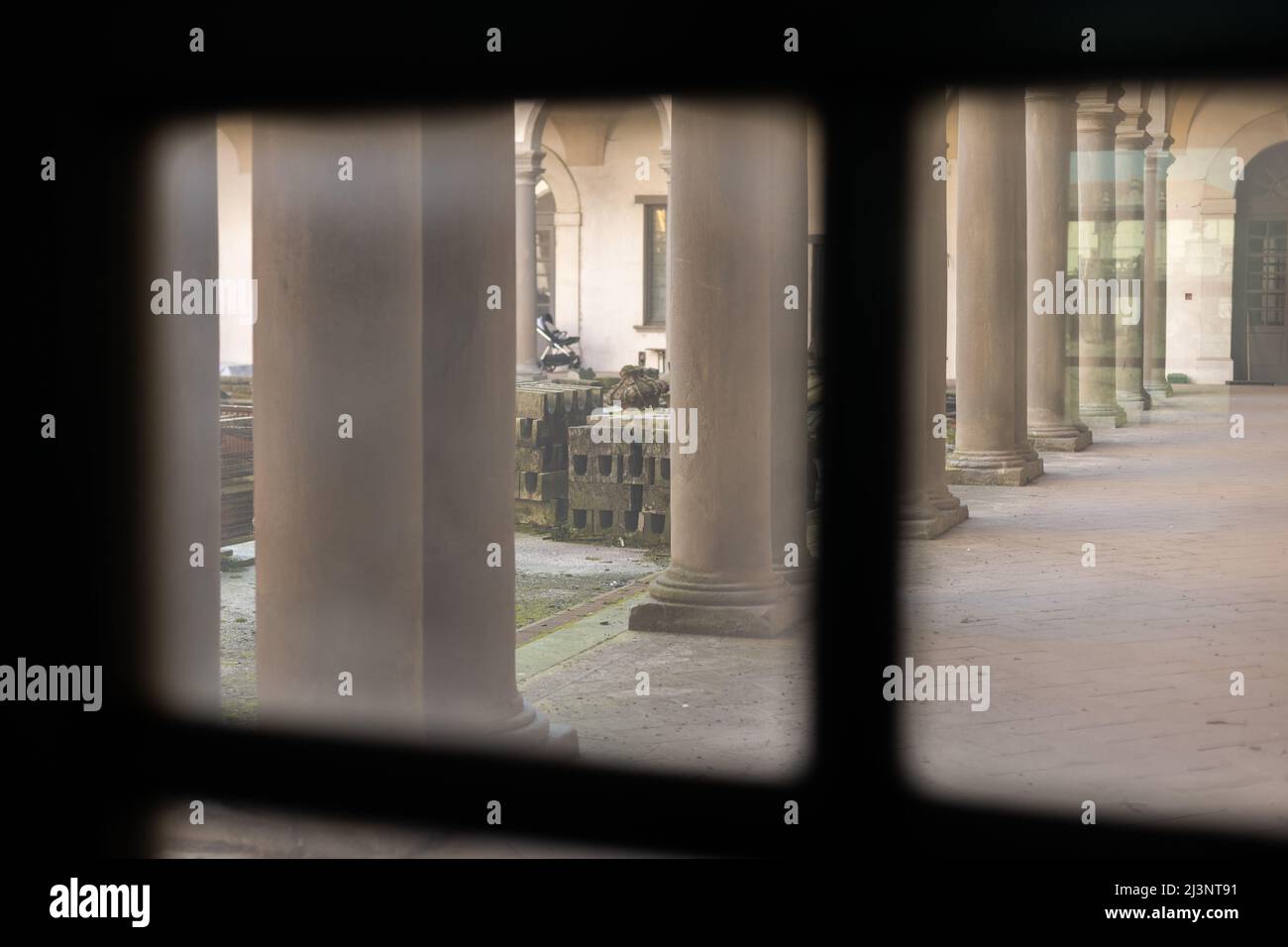 an old window with wooden frame in an old European architecture house ...