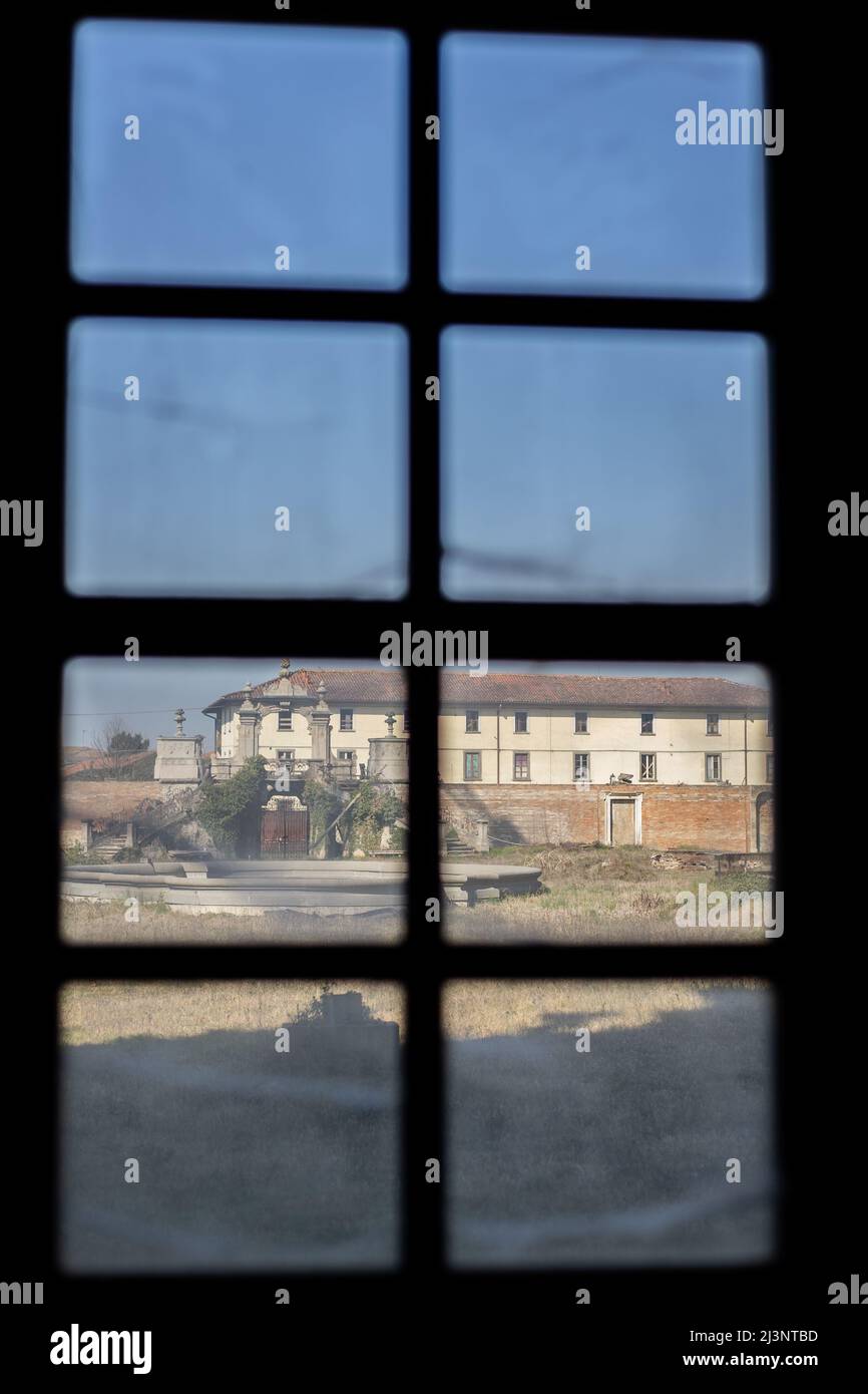 an old window with wooden frame in an old European architecture house ...