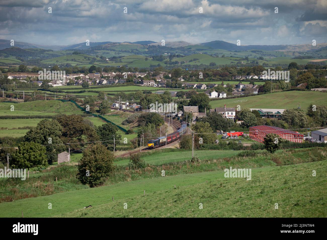 Preserved class 87 electric locomotive 87002 passing Burton In Holme ...