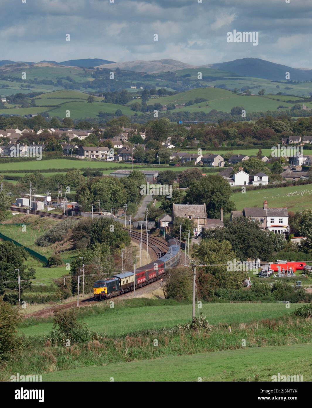 Preserved class 87 electric locomotive 87002 passing Burton In Holme ...