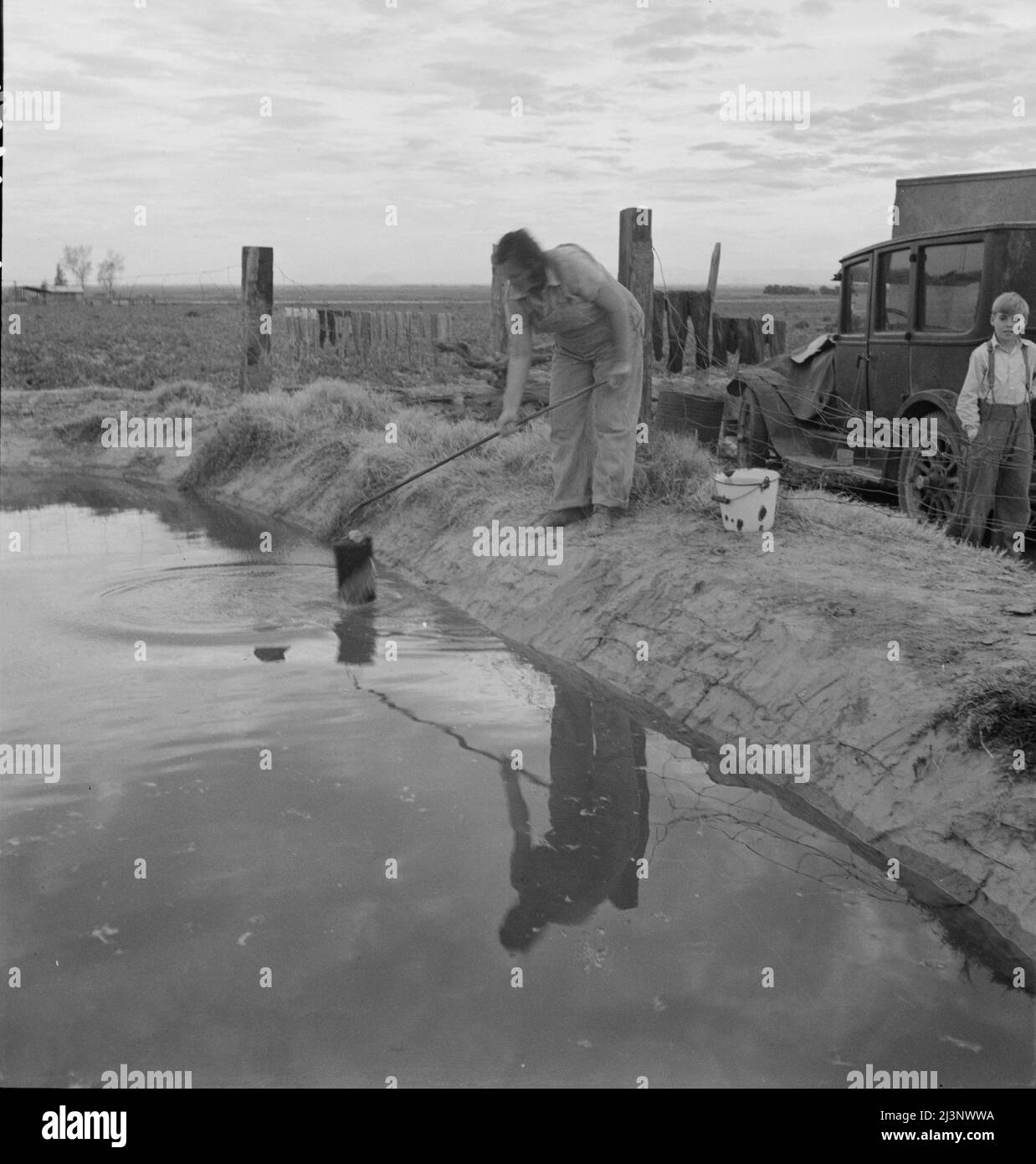 Water supply: an open settling basin from the irrigation ditch in a ...