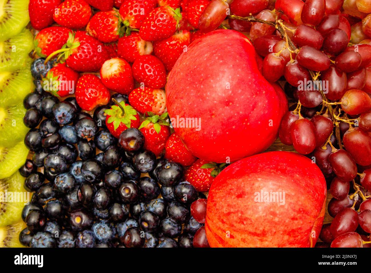Fresh fruits concept, Healthy fruits consist of grapes apple orange and ...